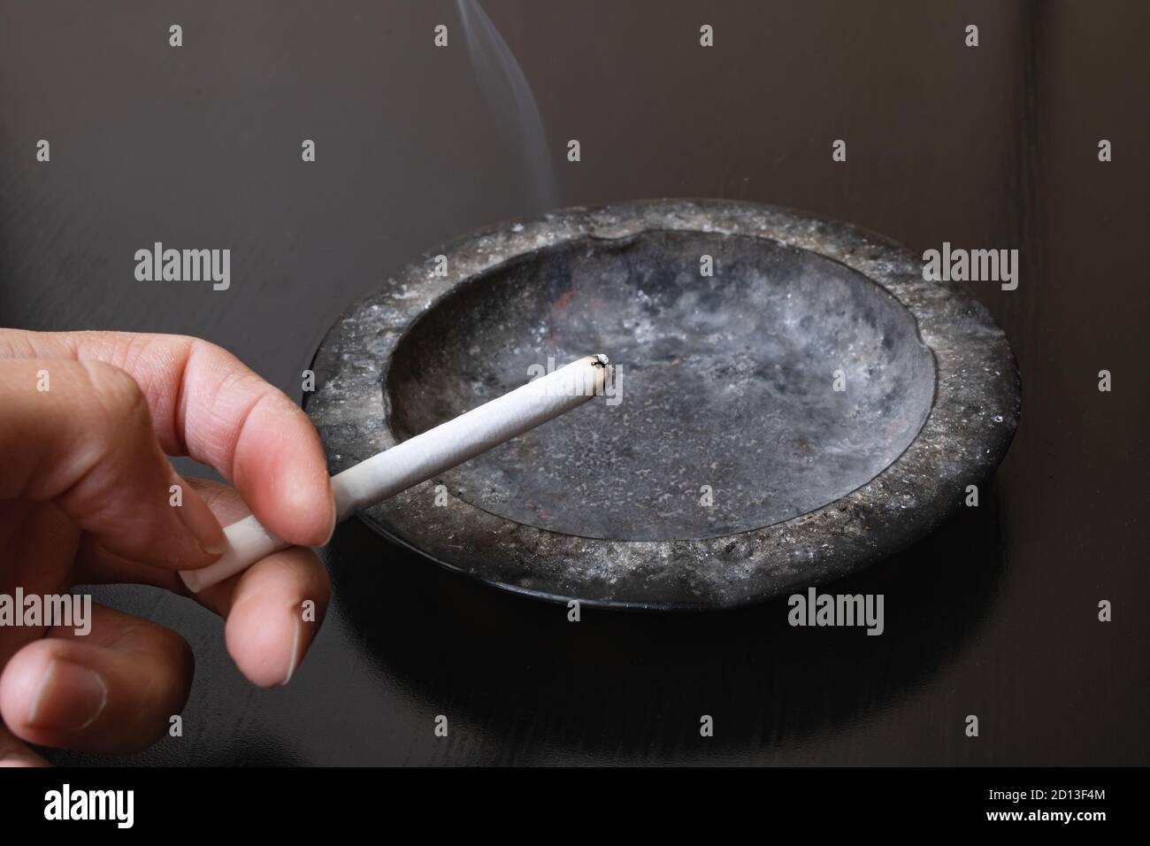 Burning cigarette in an ashtray hi-res stock photography and images - Alamy