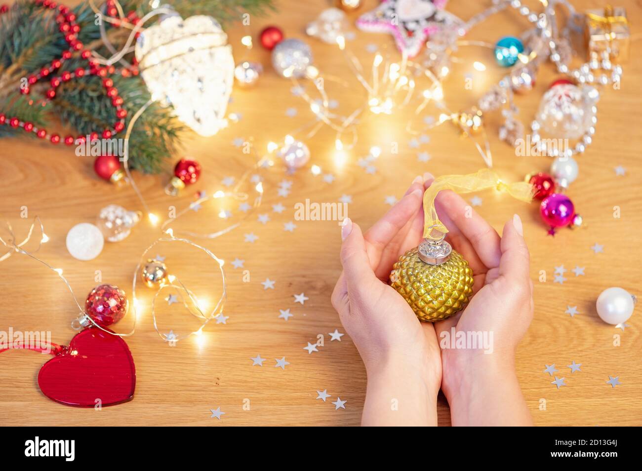 Christmas concept. Human hand hold a glass christmas bauble with ...