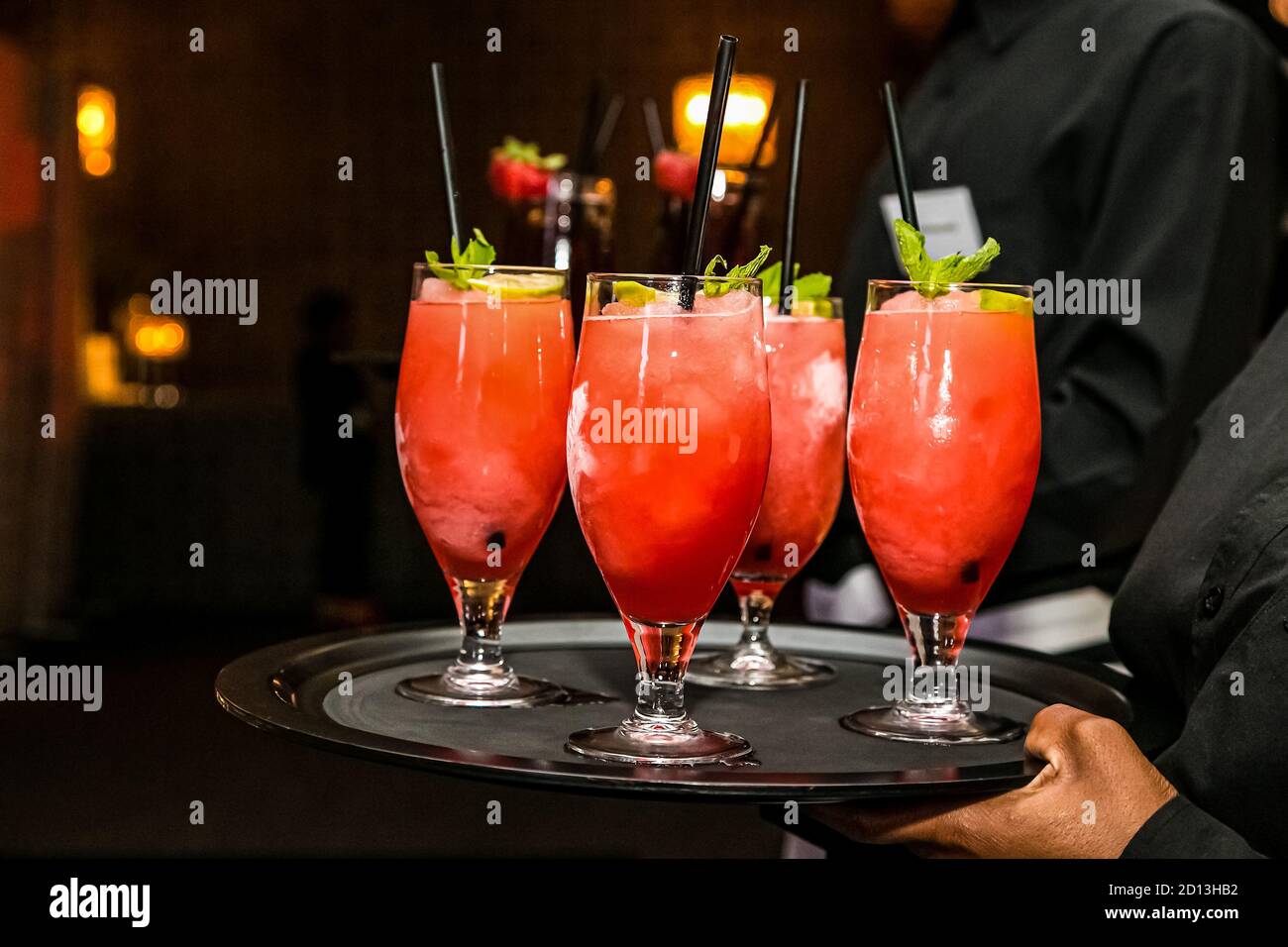 Christmas or New Years Drinks of cocktails on waiter’s tray at ...