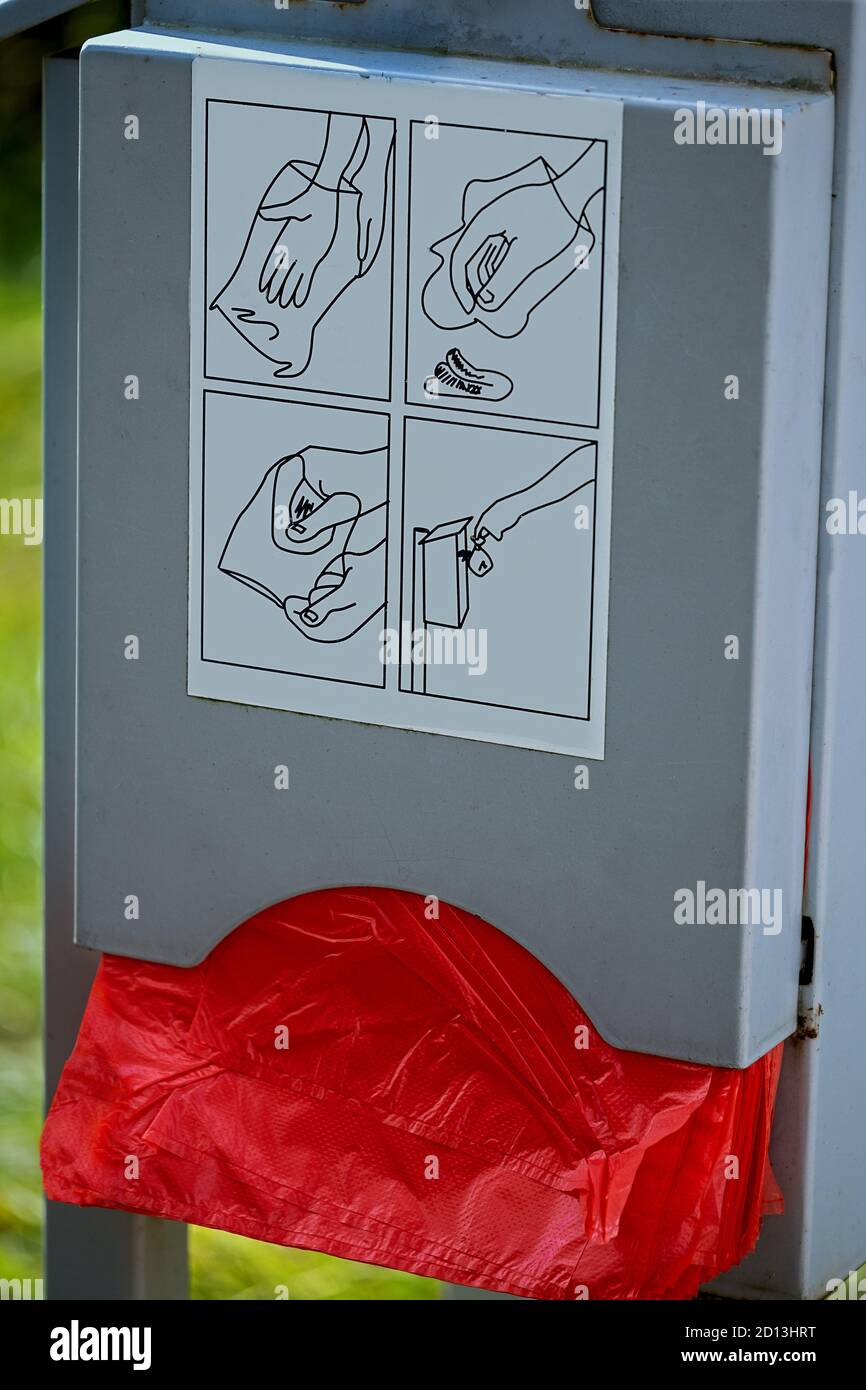 red dog poop bags in a grey metal box and explanatory illustration ...