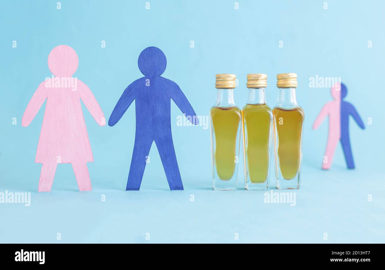 Figurines from a family tree on a blue background and bottles of ...