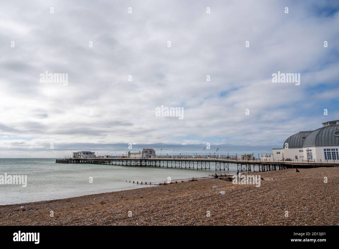 Looking west to Worthing Pier and the pebble beach in West Sussex, UK ...