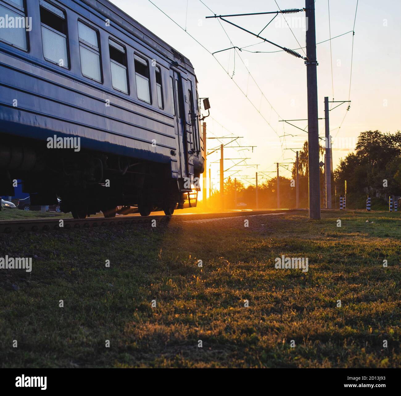 Passenger train for transporting people moves on the railroad against ...