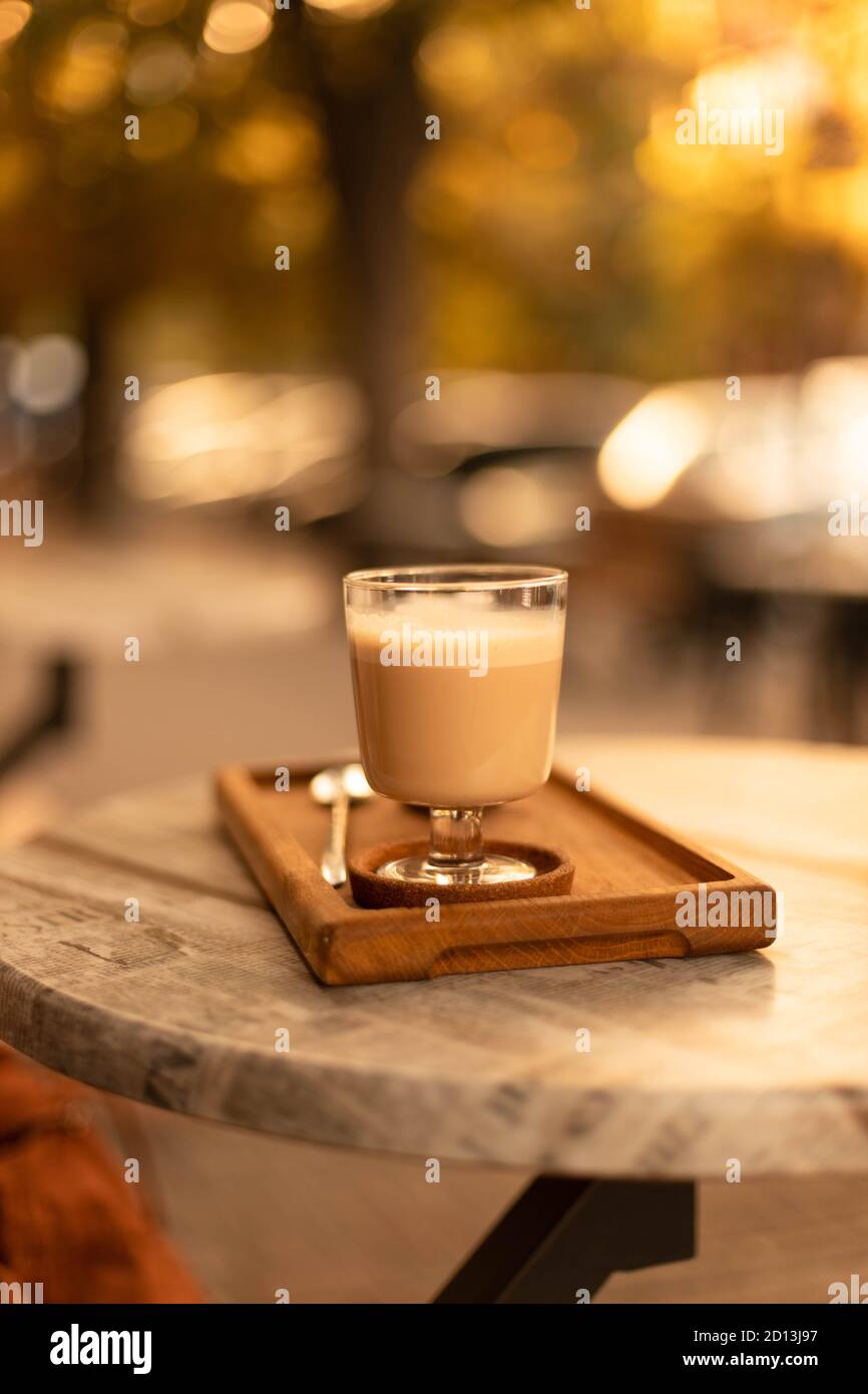 Morning coffee on the terrace in cafe in the park. Morning coffee on ...