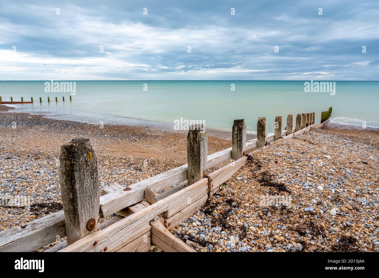 View over the English Channel from Worthing beach with old, wooden ...