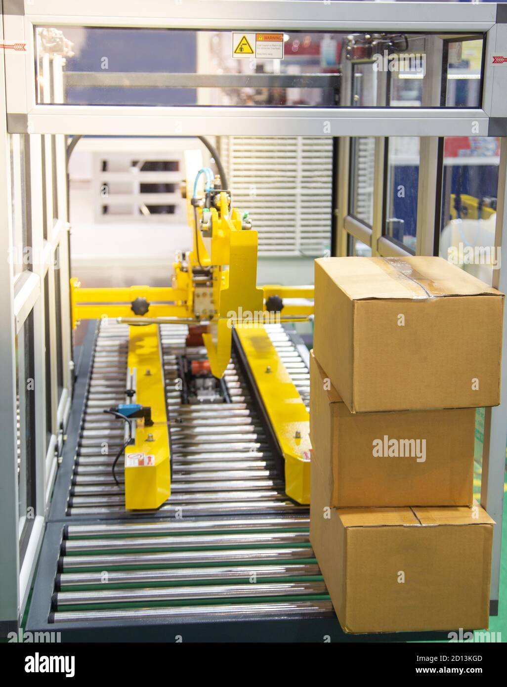 Automatic carton, cardboard tape sealing machine. Industrial logistics ...