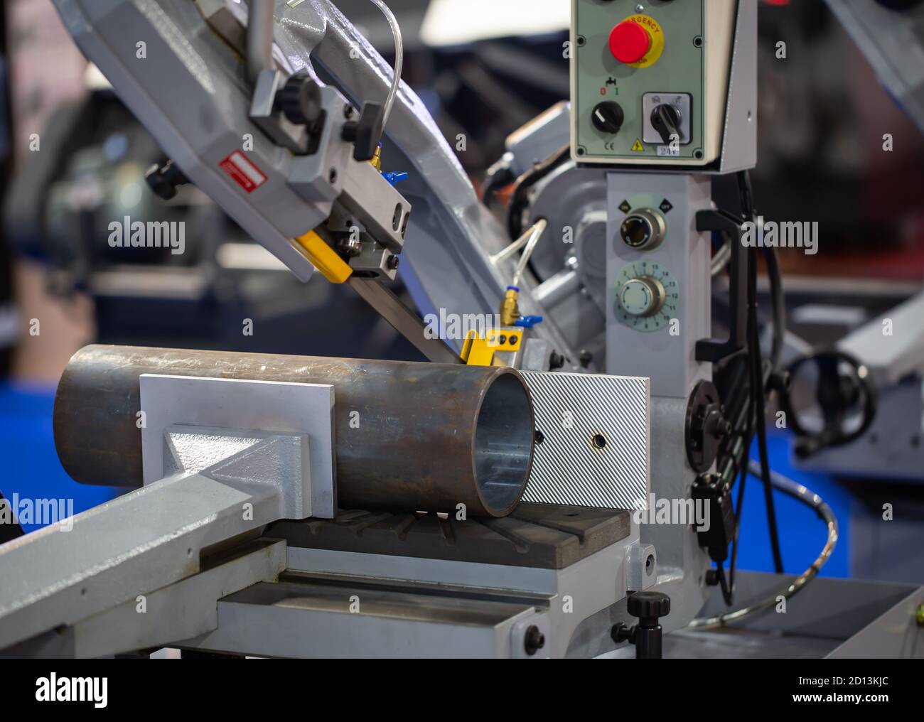 Band saw machine cutting pipe. Industrial machinery Stock Photo - Alamy