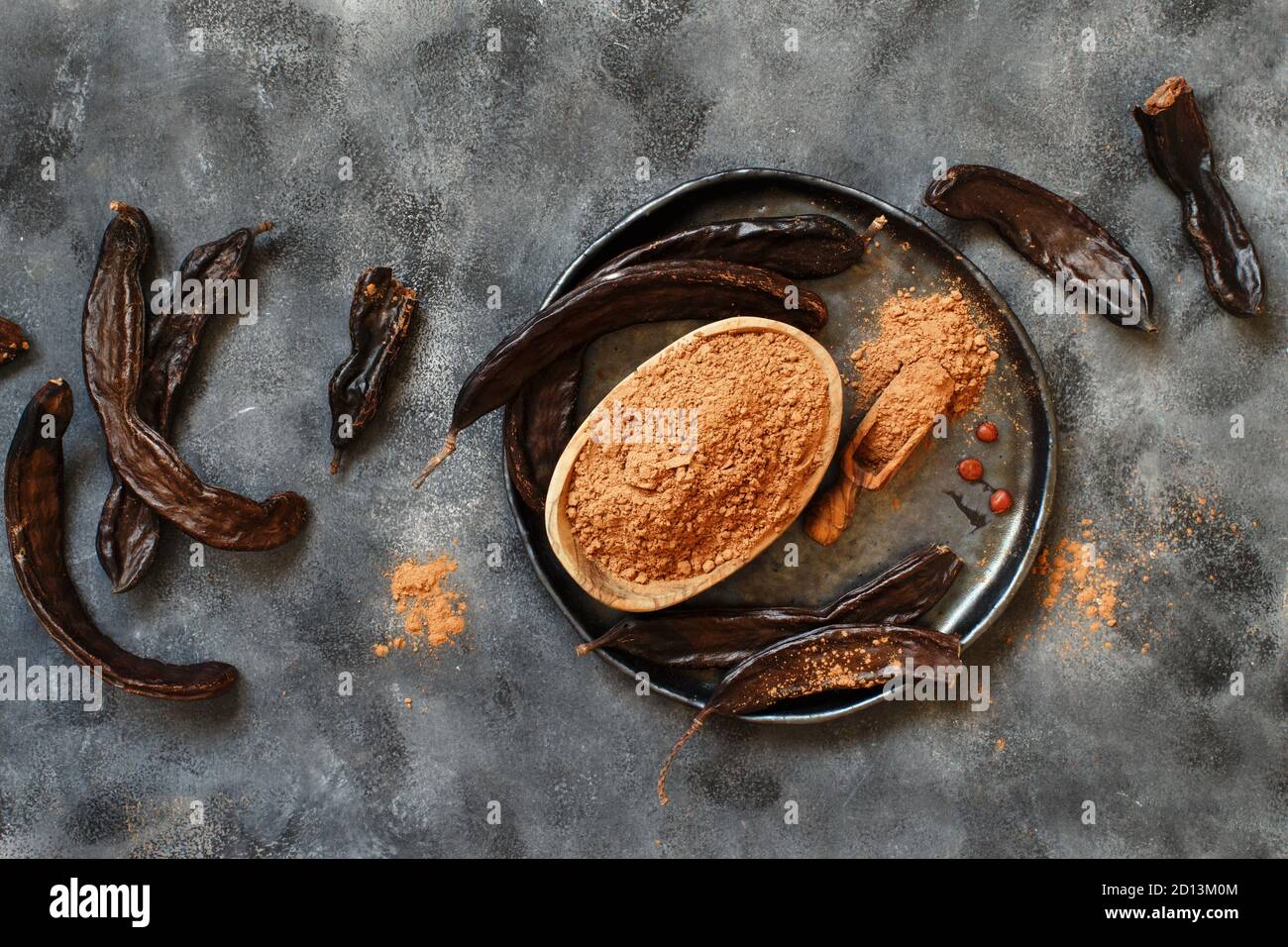 Dry carob pods and powder top view Stock Photo - Alamy