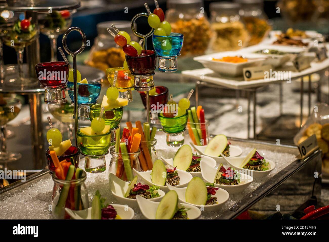 a buffet spread full of bite sized delicious canapes on a table Stock ...