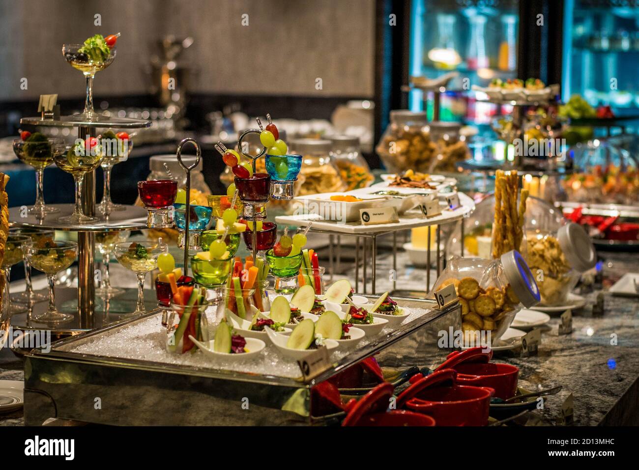 a buffet spread full of bite sized delicious canapes on a table Stock ...