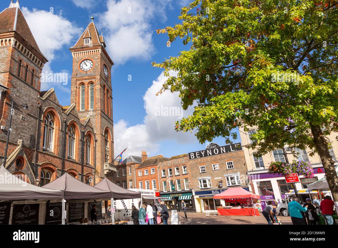 Clock tower of town hall and historic buildings in Market Place ...