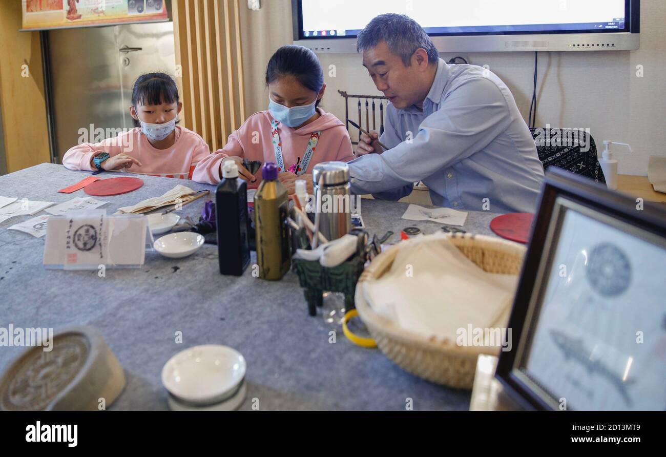 Beijing, China. 5th Oct, 2020. Children experience rubbing of ancient ...