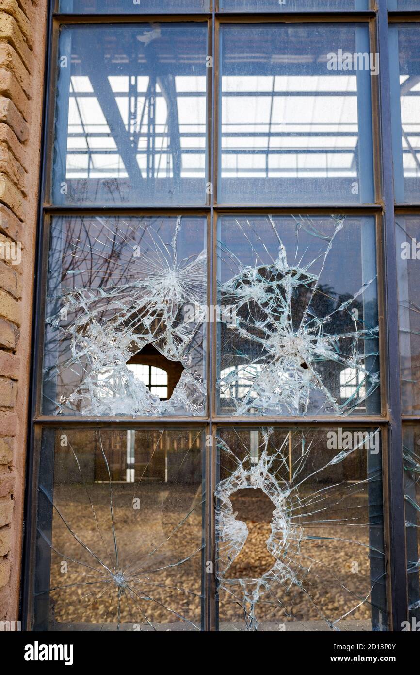 Window with a broken glass in a disused old factory Stock Photo - Alamy