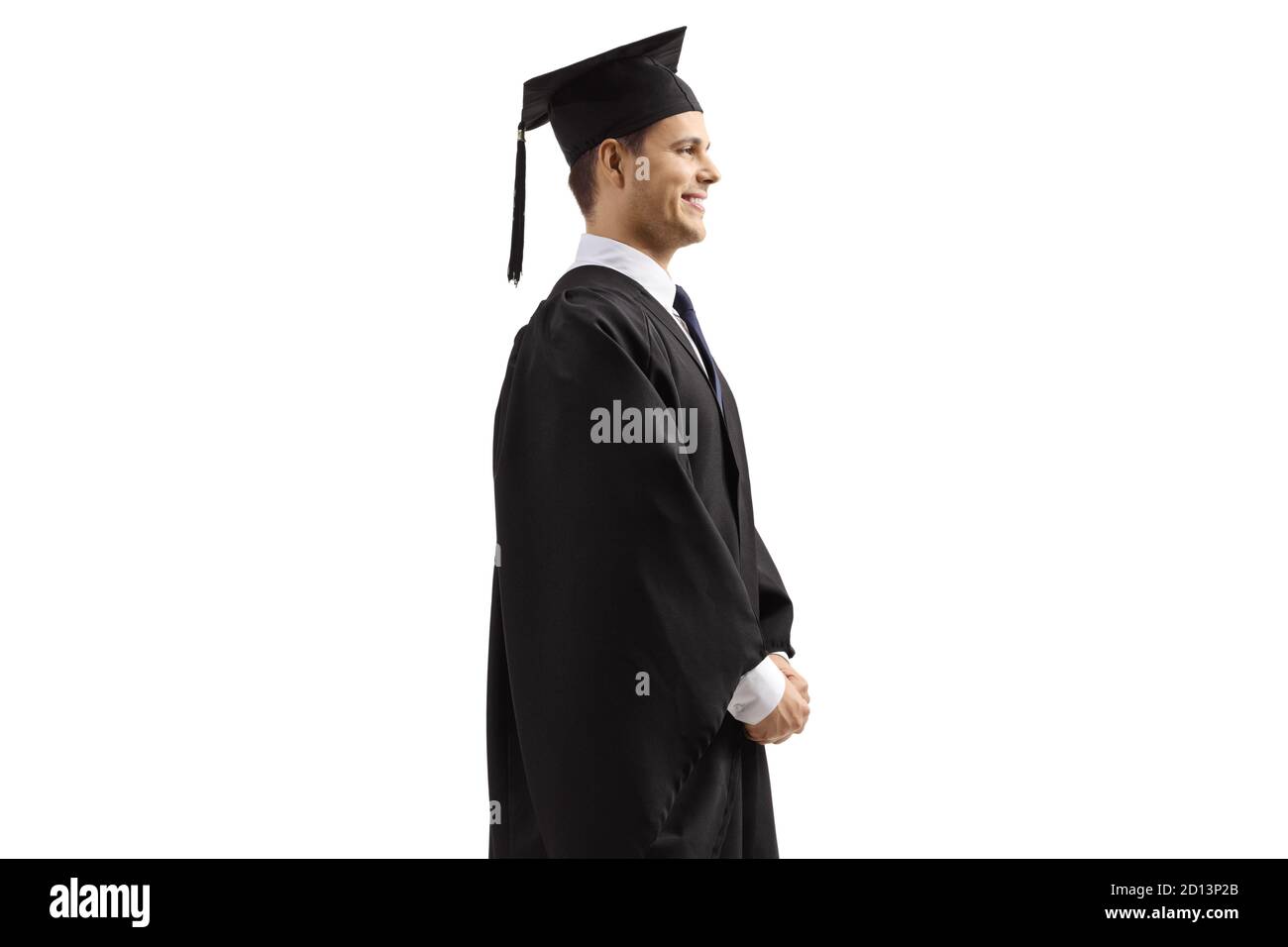 Young man in graduation gown isolated on white background Stock Photo ...
