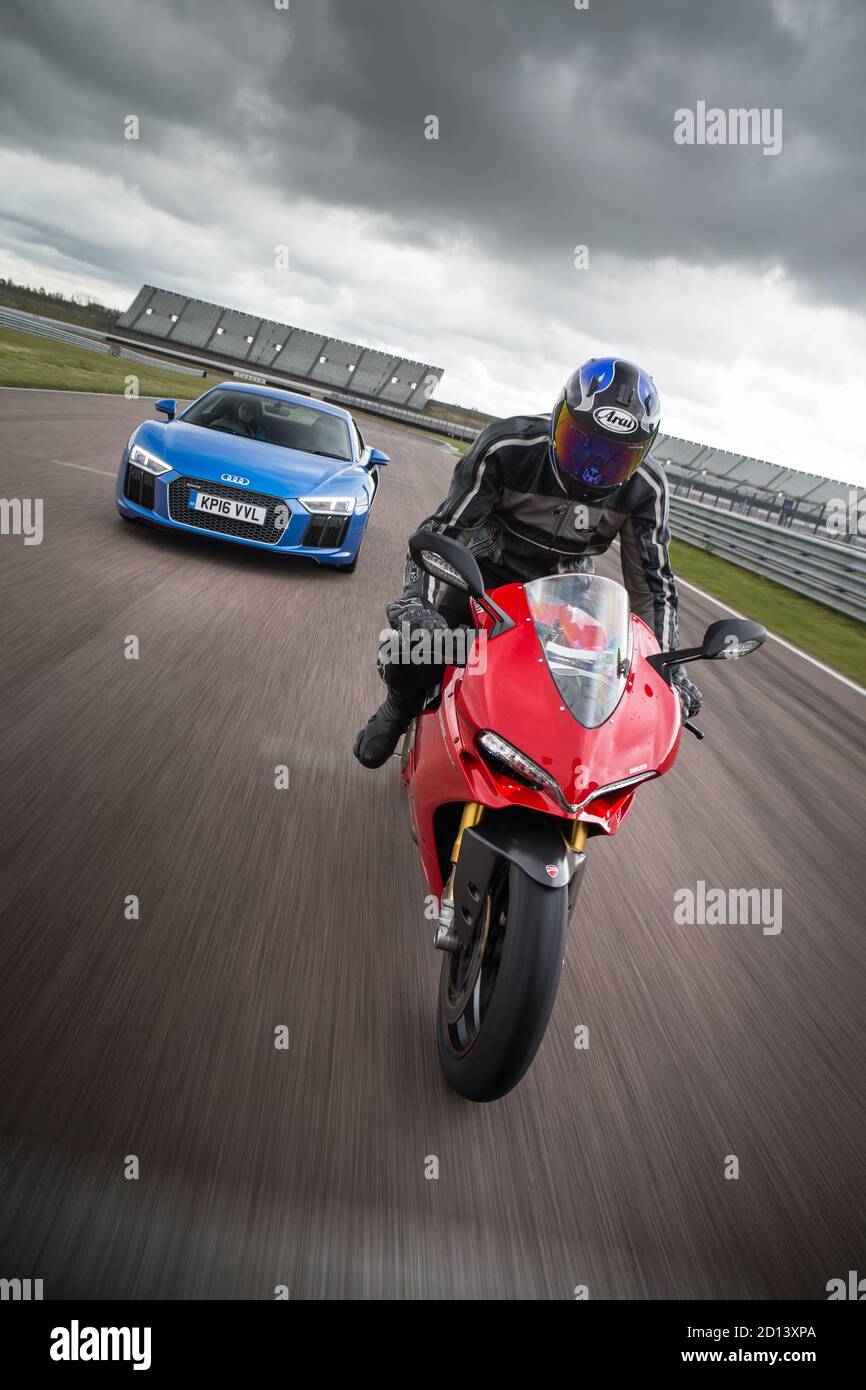 Audi R8 Races Motorcycles