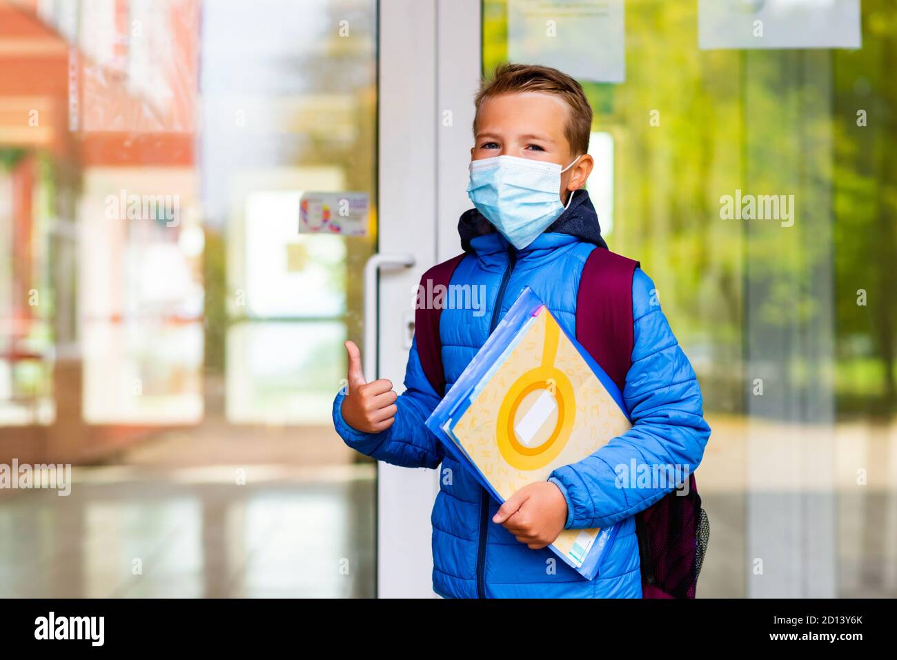 Cute school boy 9s old wears casual clothes and backpack face mask near ...