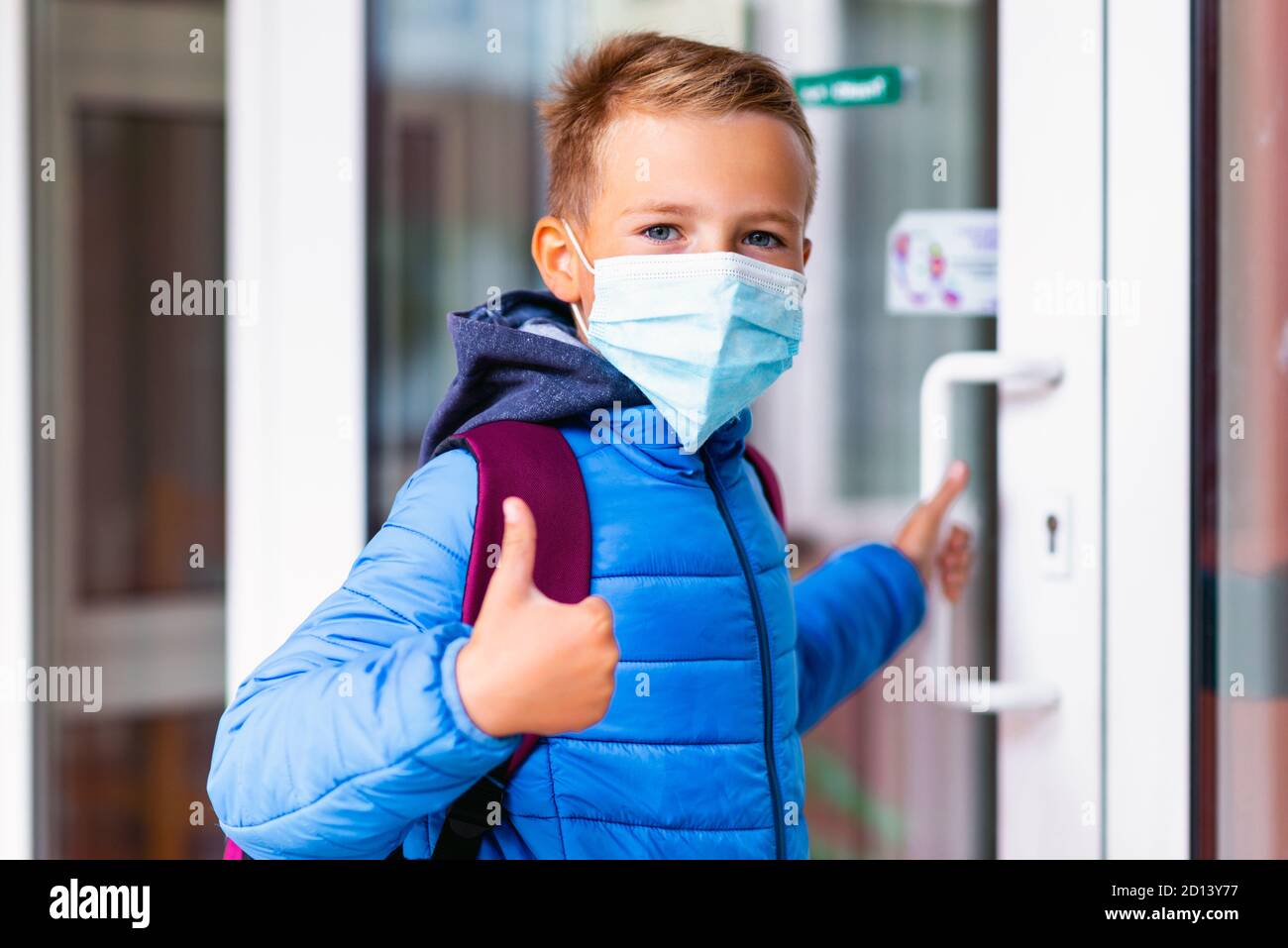 Cute school boy 9s old wears casual clothes and backpack face mask near ...