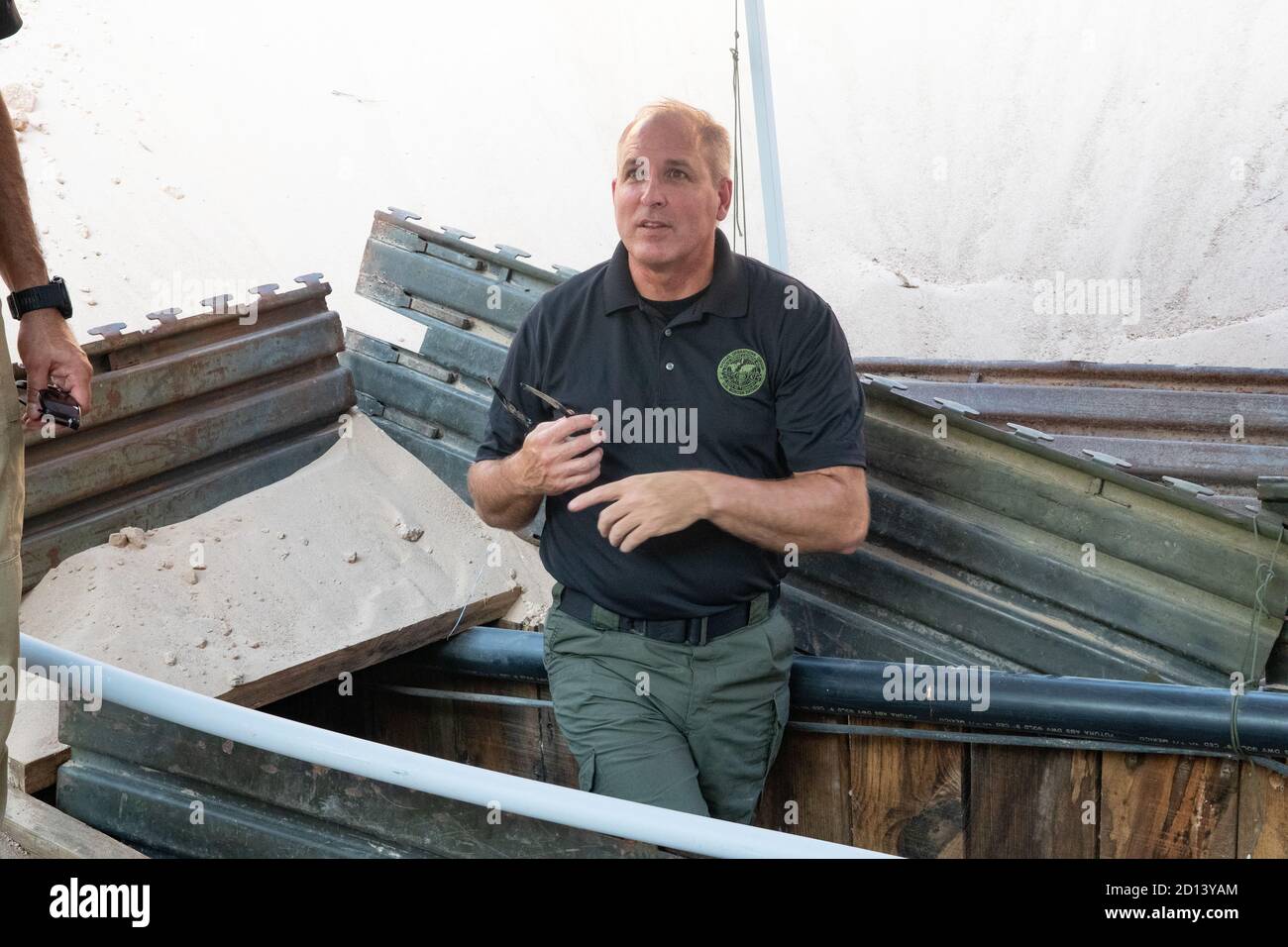 Acting Commissioner Mark Morgan inspects a newly discovered tunnel in ...