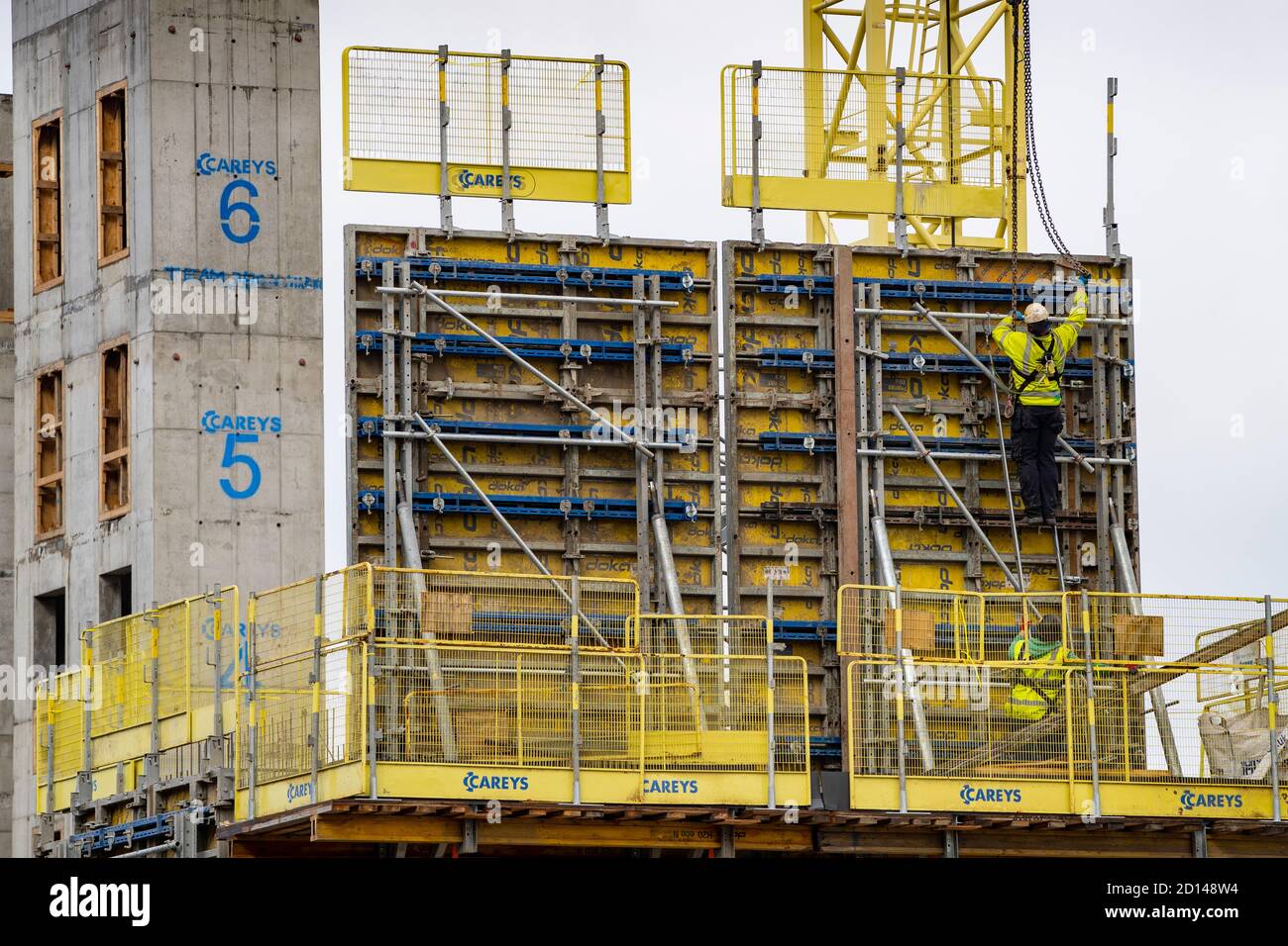 Construction worker fitting formwork for a concrete pour at Moda's new ...
