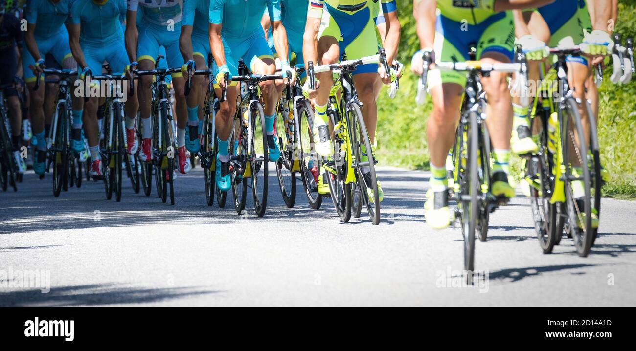 cycling race - athletes in group Stock Photo - Alamy
