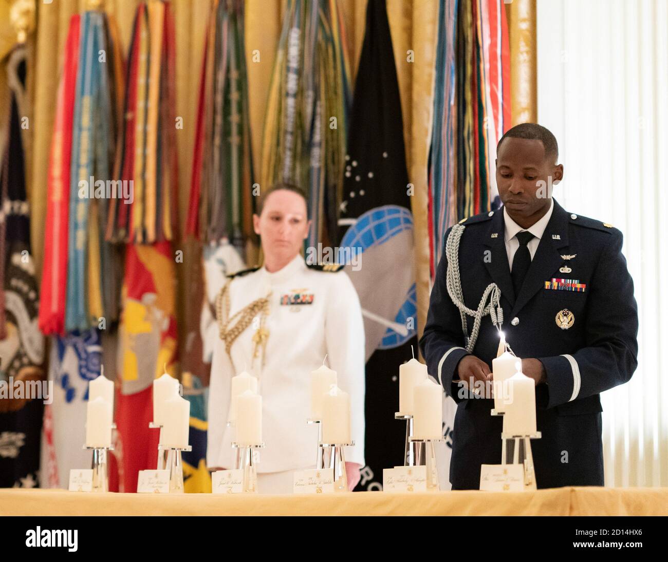 On September 27, 2020, a White House social aide lit a candle in ...