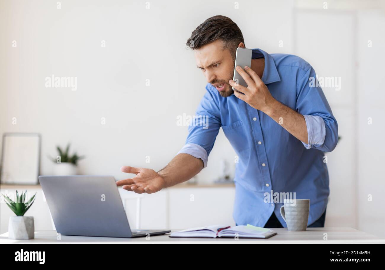Angry man at computer hi-res stock photography and images - Alamy