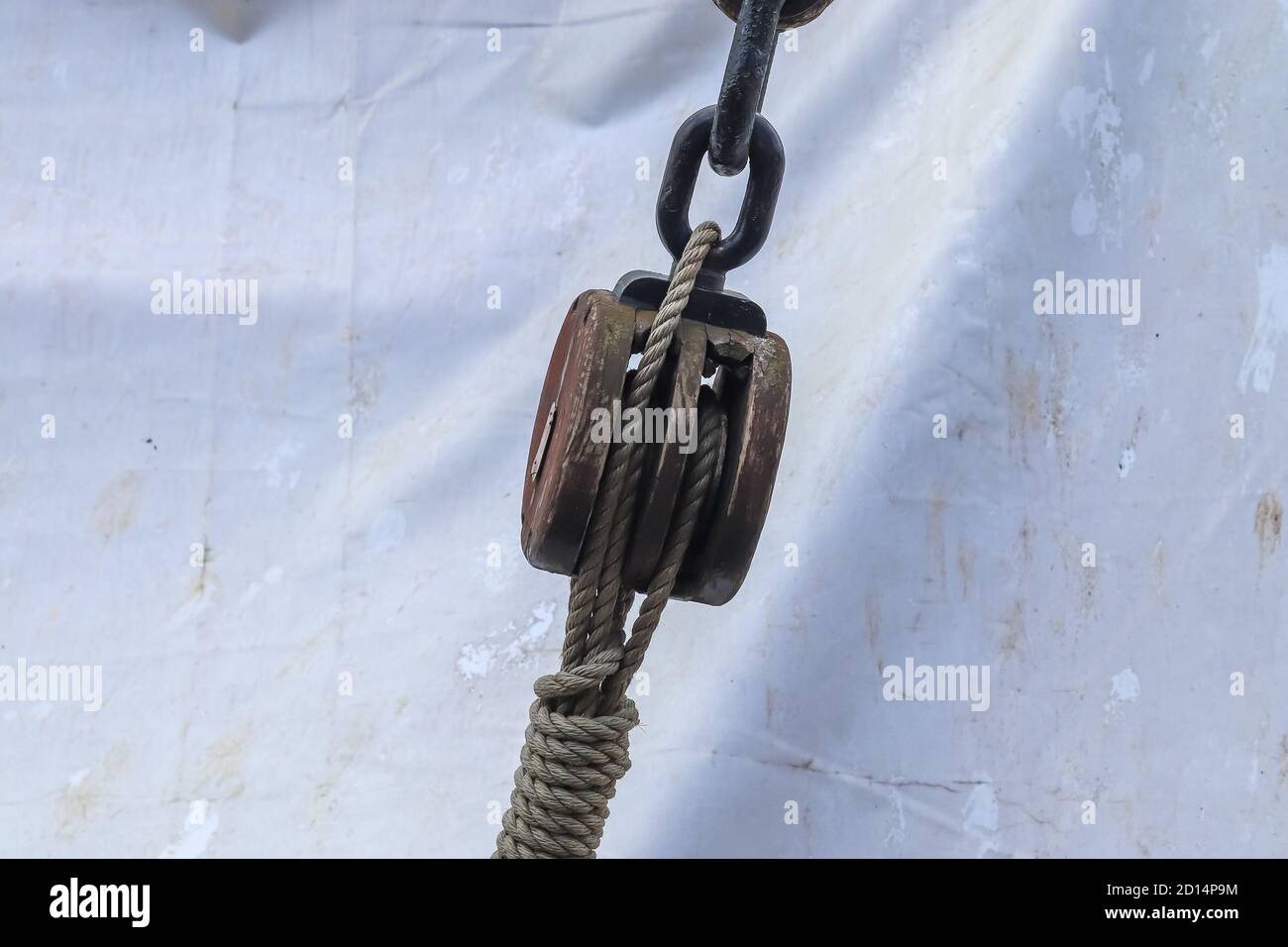Closeup of old rope pulley of a ship Stock Photo - Alamy