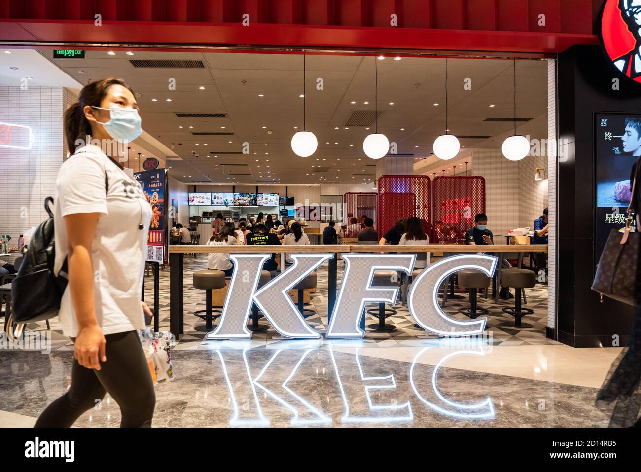 A pedestrian walks past an American fast food restaurant chain ...