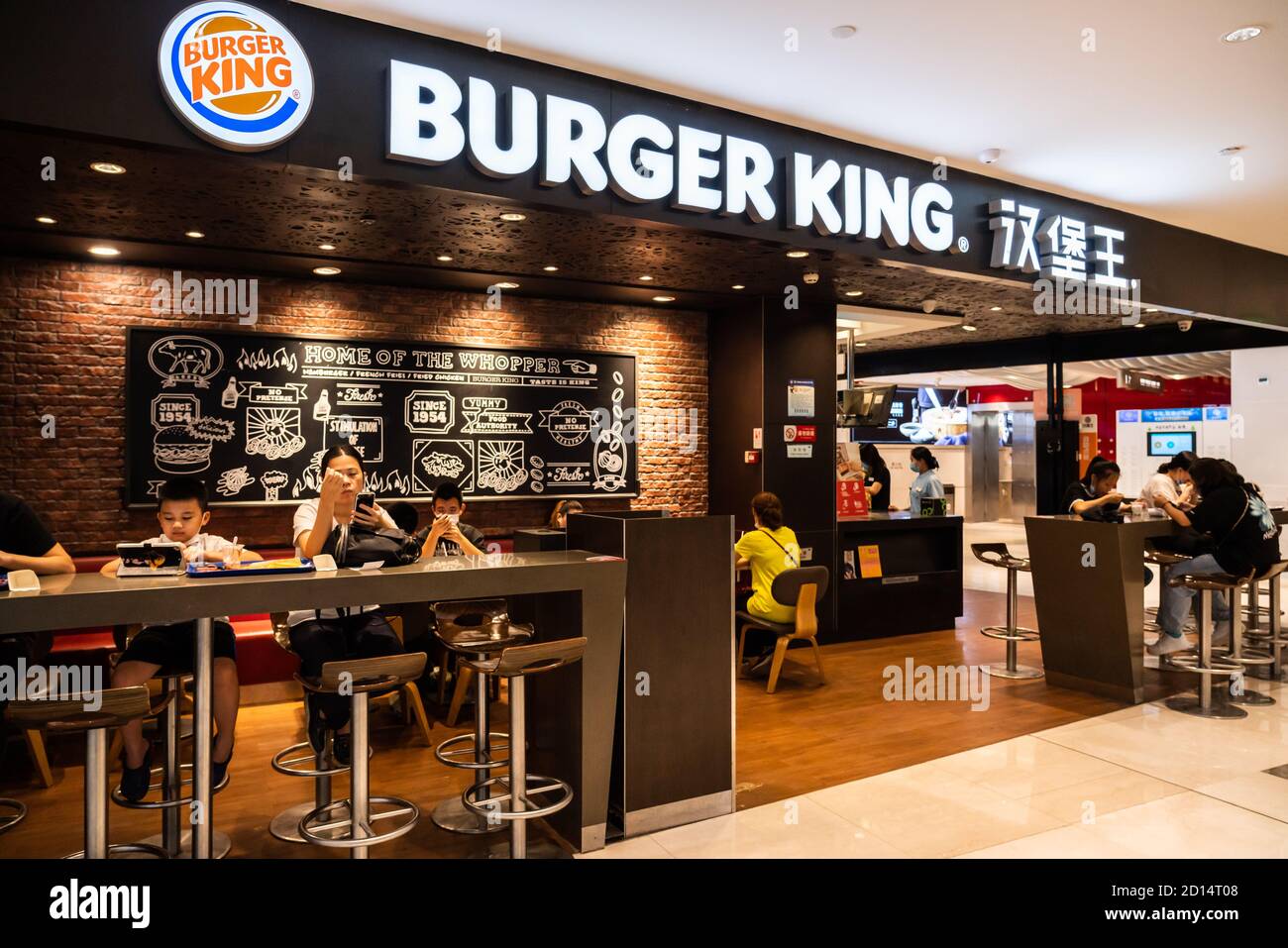Customers at an American fast food restaurant chain Burger King store ...