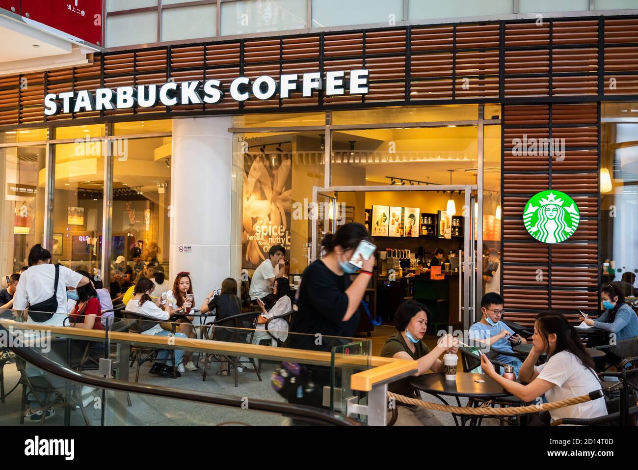 Customers at an American coffee company and coffeehouse chain Starbucks ...