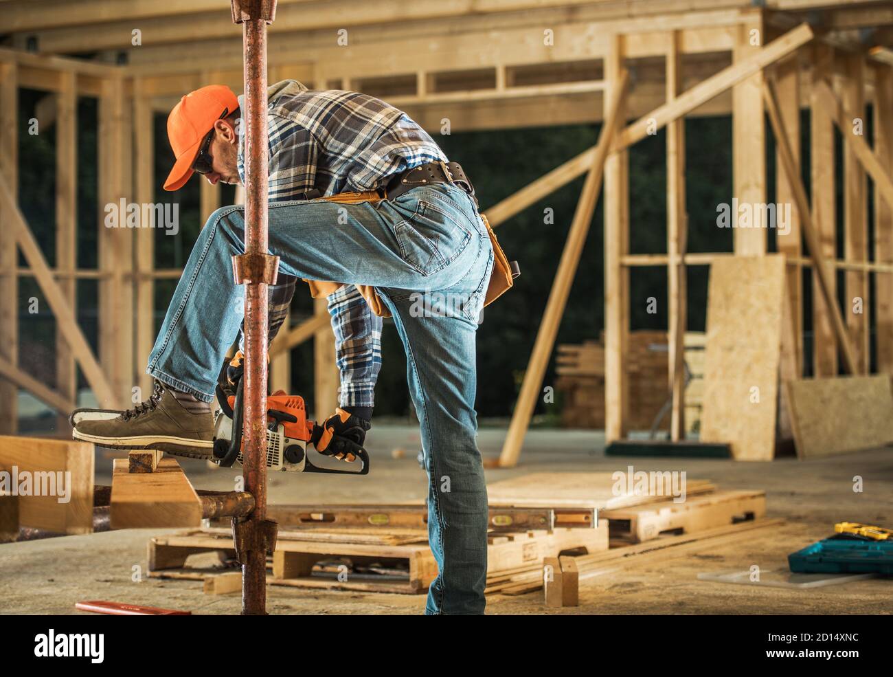 Caucasian Construction Contractor in His 40s with Chainsaw Power Tool ...