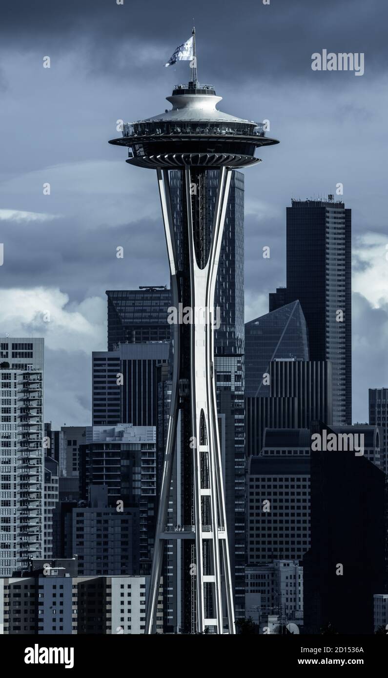 The iconic Space Needle with the Seattle skyline lit by a setting sun ...
