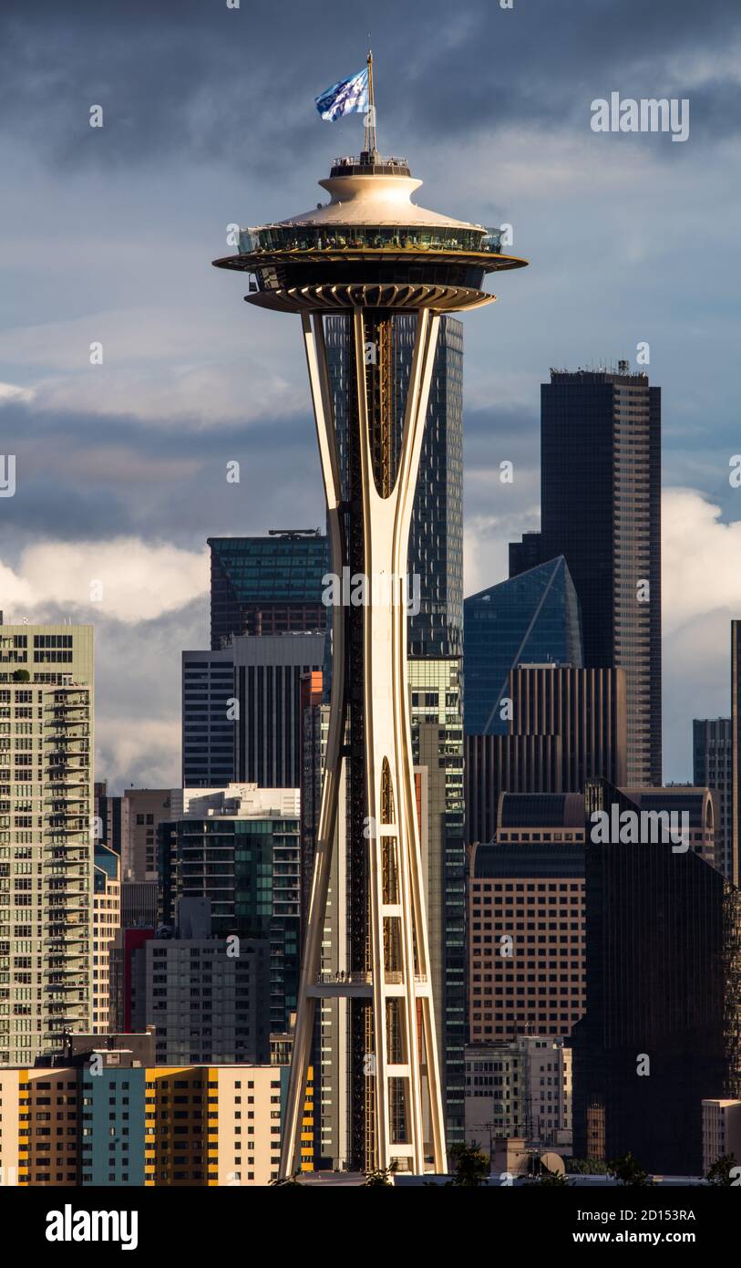 The iconic Space Needle with the Seattle skyline lit by a setting sun ...