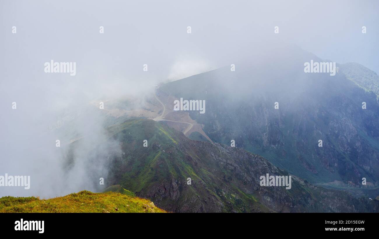 Beautiful mountain landscape. High-mountain massif, clouds over ...