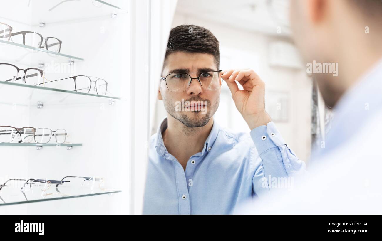 Portrait of handsome young man wearing spectacles Stock Photo - Alamy