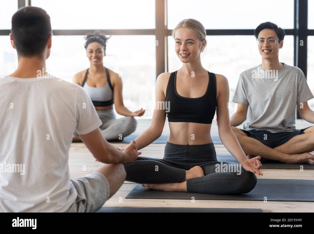 Group Yoga. Diverse Sporty Multicultural People Meditating Together ...