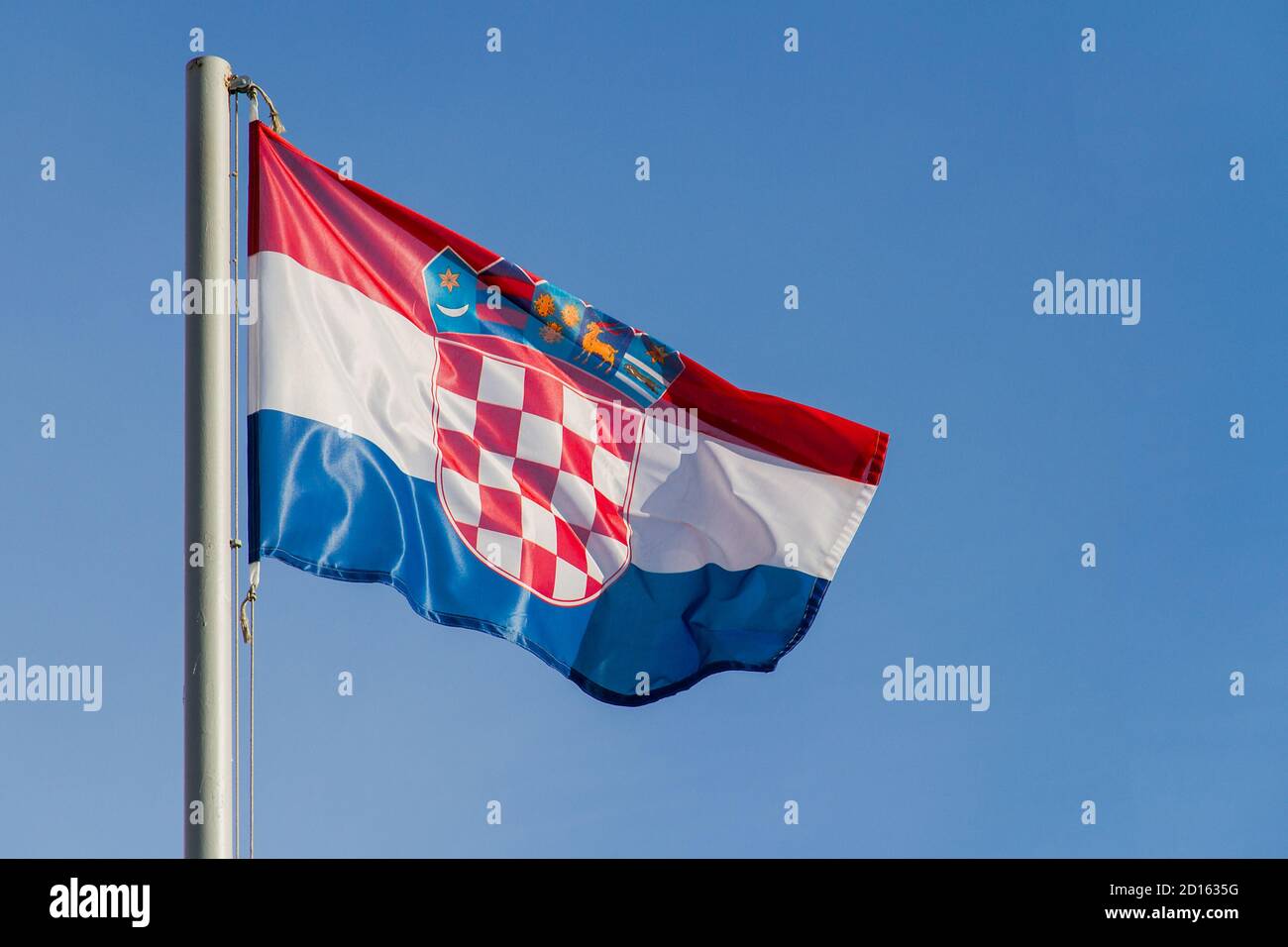 Croatian flag is waving in front of blue sky Stock Photo - Alamy
