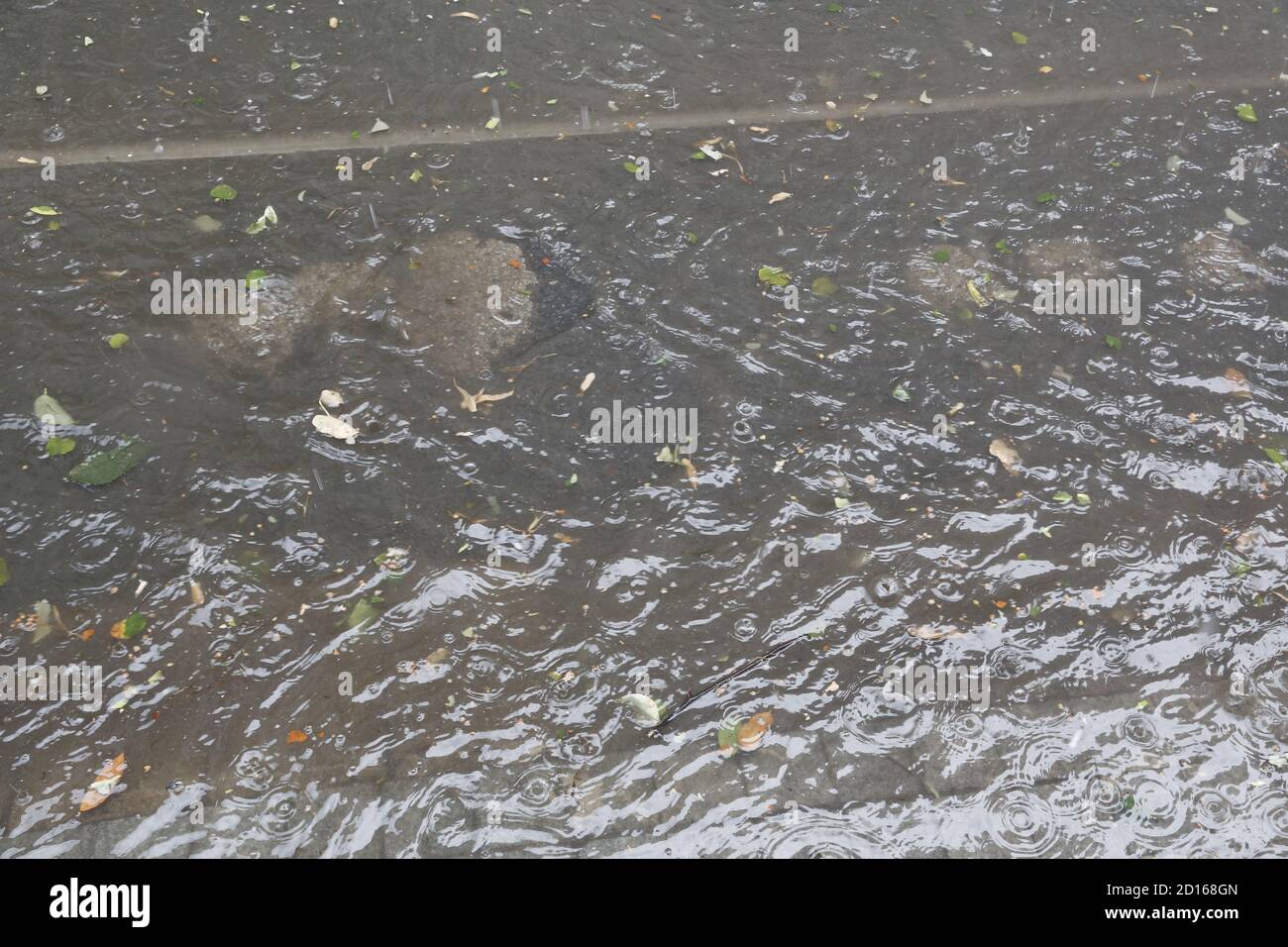 Raindrops falling on the ground hi-res stock photography and images - Alamy
