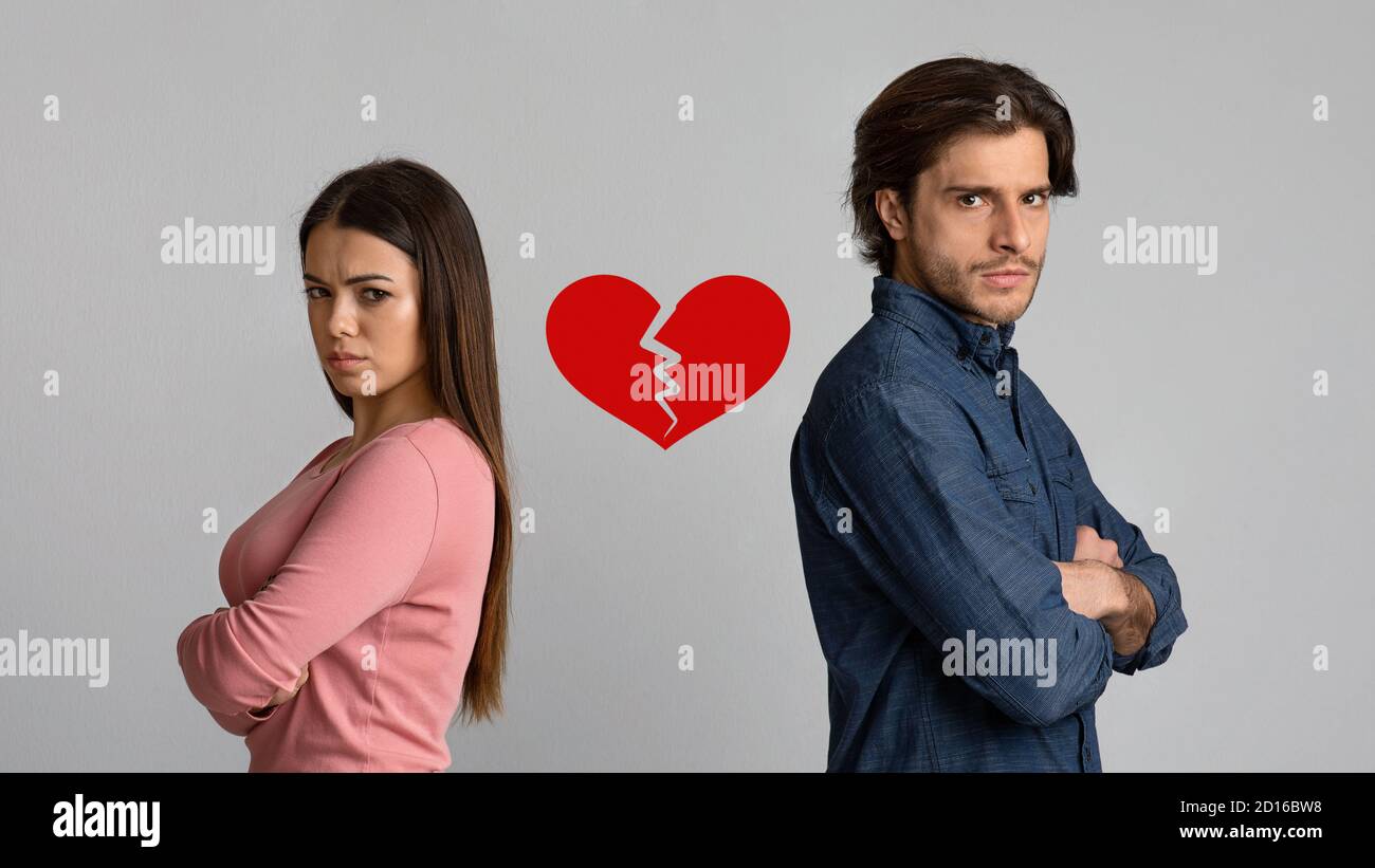 Beautiful man and woman are standing with back to back Stock Photo - Alamy