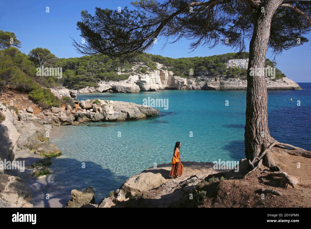 Spain, Balearic islands, Minorca, cala Mitjan, woman in hippie dress ...