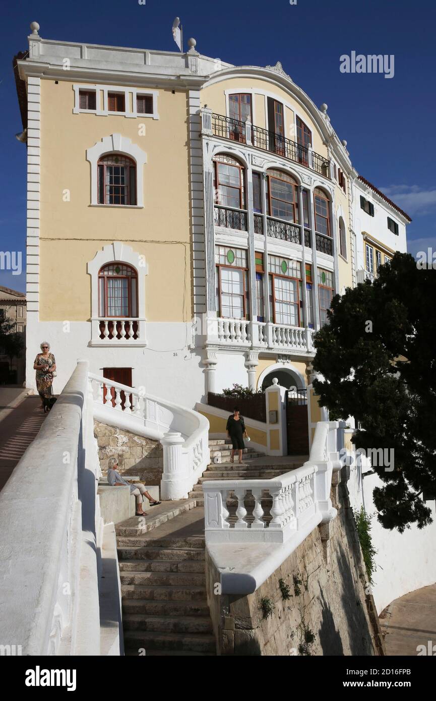 Spain, Balearic islands, minorca, Mahon, old women in front of a ...
