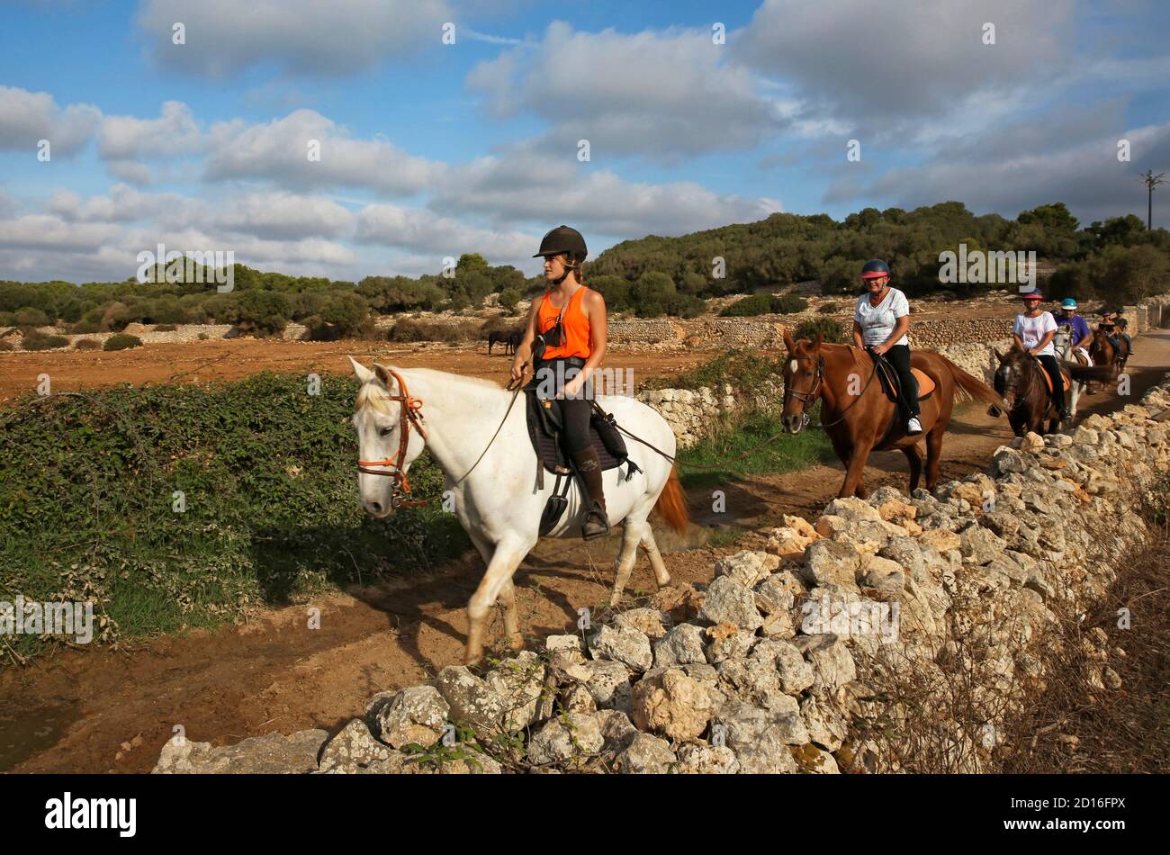 Spain, Balearic islands, minorca, cala galdana, young horsewoman of the stable Menorca a cavall ...