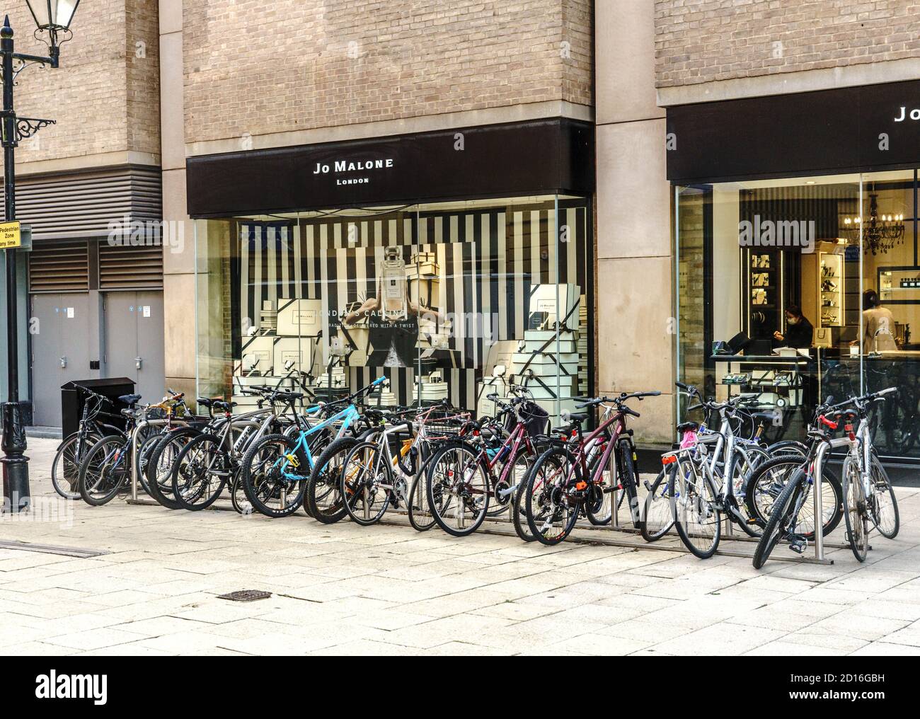 A row of bikes tethered to a bicycle rack, Queen Street, Oxford, UK ...