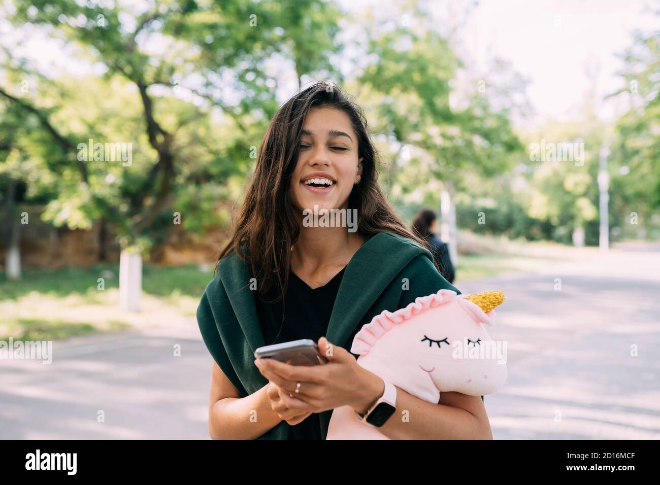Young Attractive Girl Typing Messages on her Mobile Stock Photo - Alamy