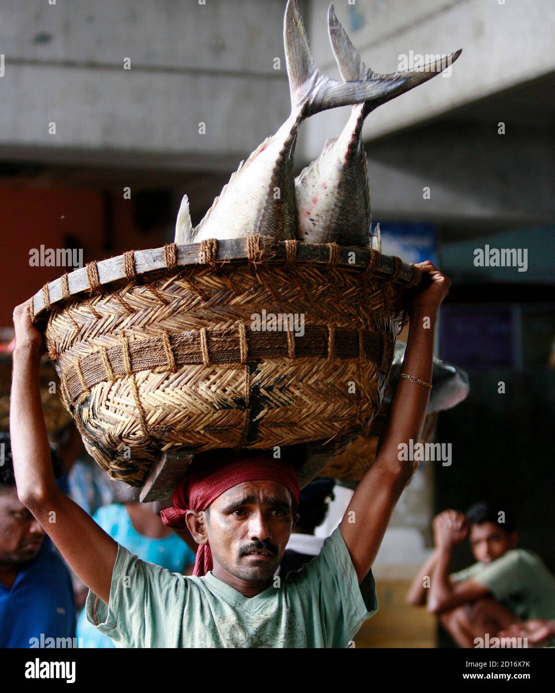 Man carrying tuna fish hi-res stock photography and images - Alamy