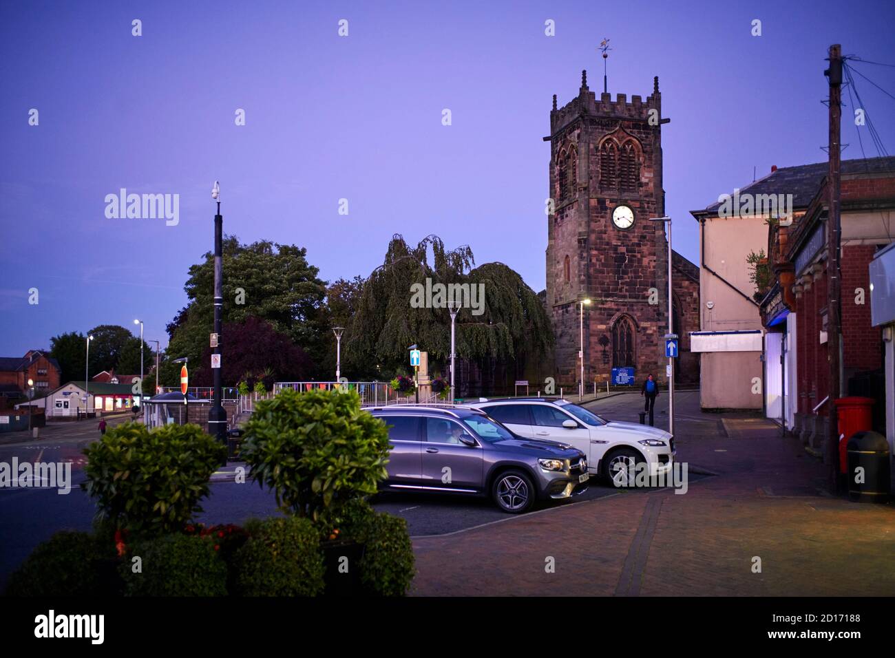 Middlewich with cars parked outside convenience shop open late in the ...