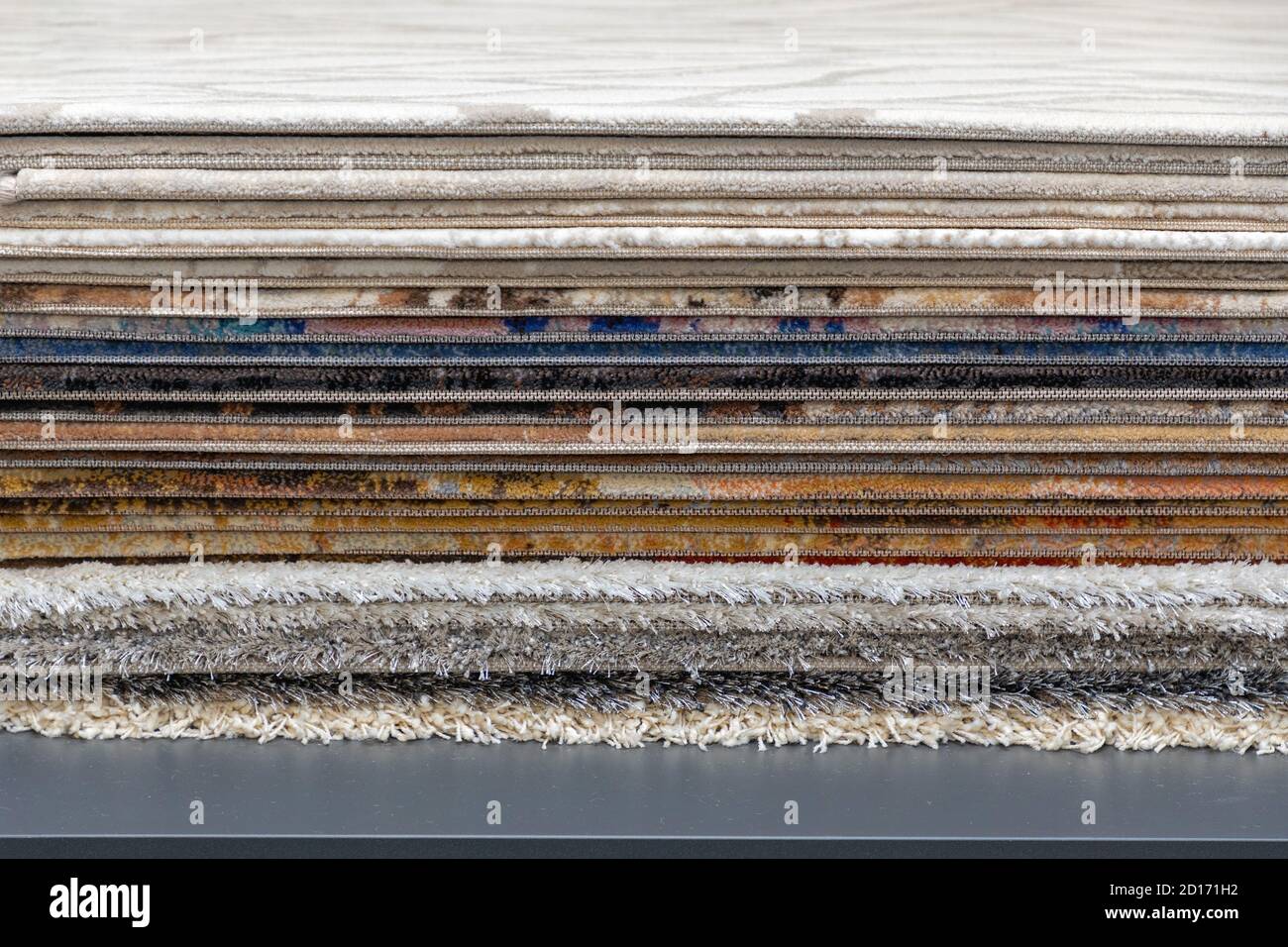 Stacked Layers of Carpets and Rugs Variety Selection Stock Photo - Alamy