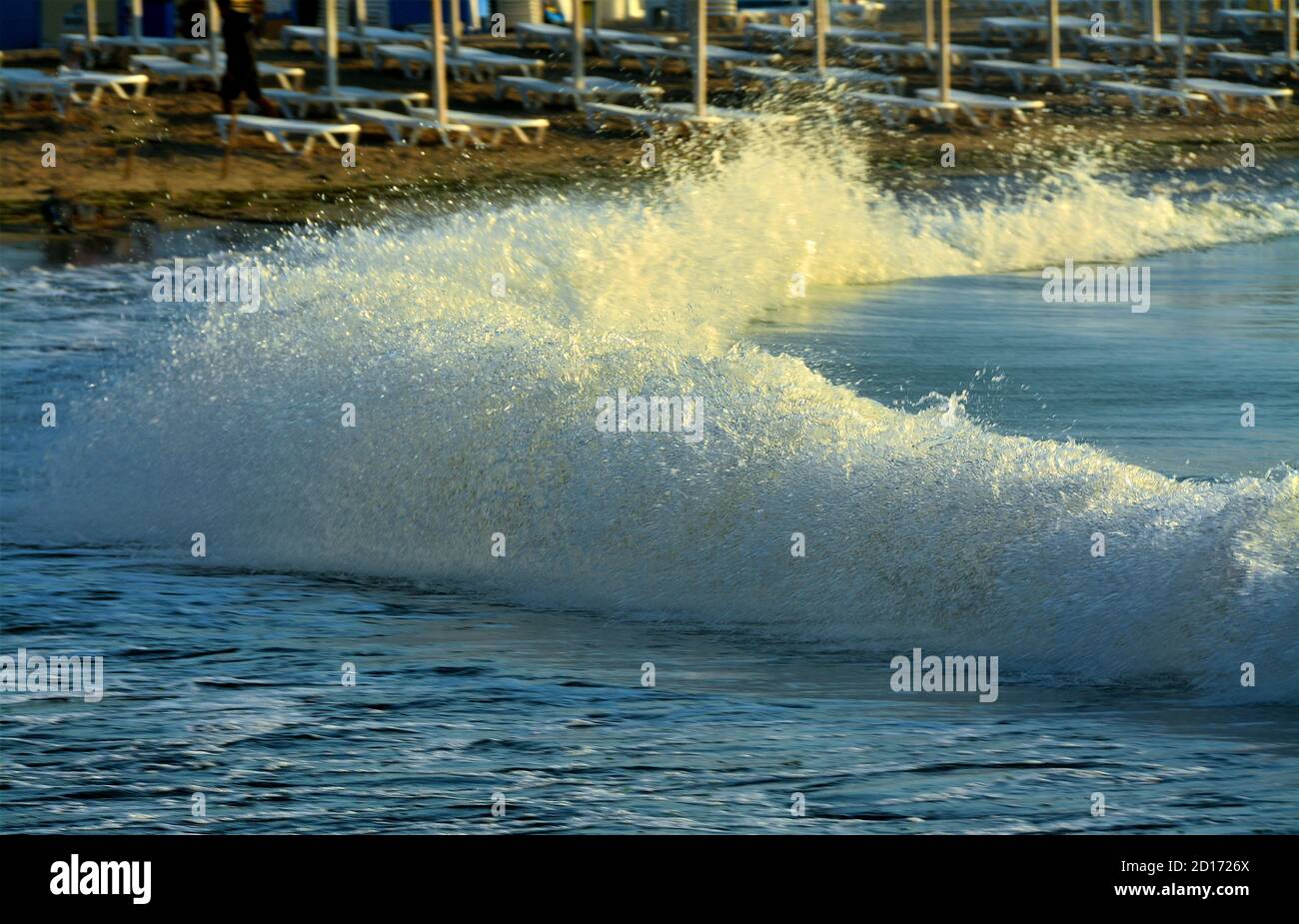 Closeup of seawater splashing on the beach Stock Photo - Alamy