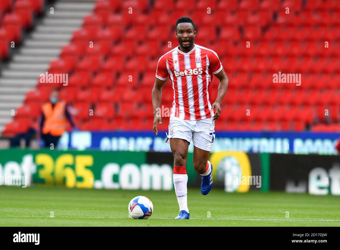 John Obi Mikel (13) of Stoke City runs forward with the ball Stock ...