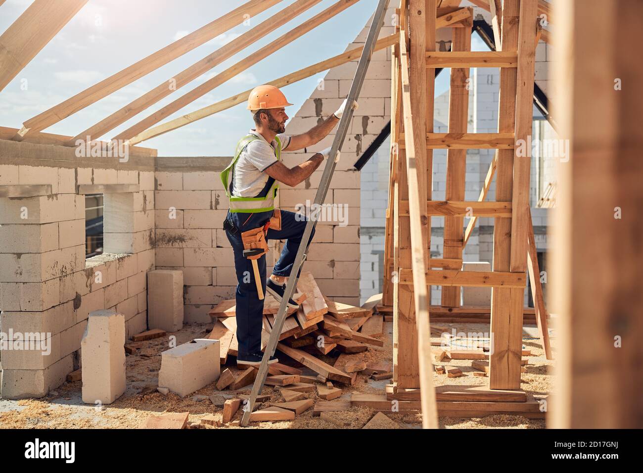 Strong builder working on the construction site Stock Photo - Alamy